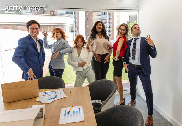 group of diverse business people joking, pose funny making faces and ...