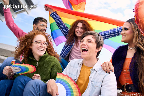 Diverse young friends cheerful group celebrating gay pride festival day ...