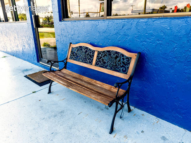Close up outdoor waiting seat of wooden bench at storefront (1708192705 ...