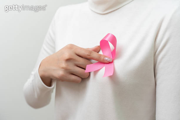 Breast Cancer. Beautiful woman stuck pink ribbon symbolizing World ...