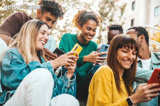 Group of multiracial young people using smart mobile phone device ...