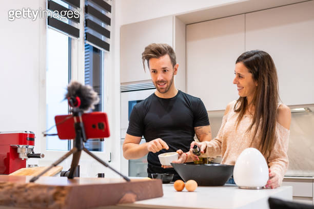 Couple food vlogger making video while cooking in kitchen (1706782398 ...
