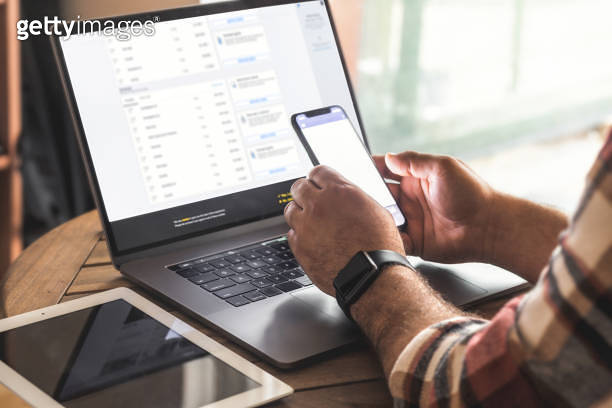 Male freelancer or entrepreneur working from home using laptop and ...