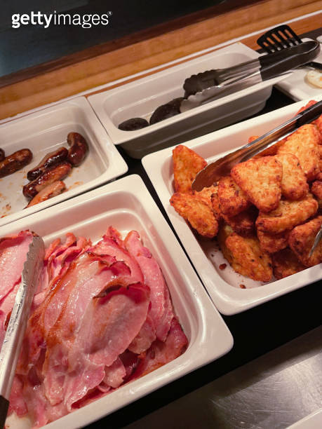 Close-up image of hot plate food bar of full-English fried breakfast ...