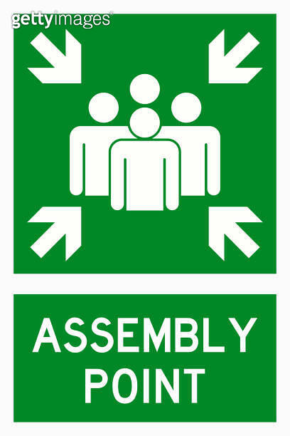 isolated emergency exit, assembly point fire safety symbols on green ...