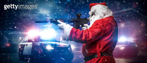 Action Santa: Armed Santa Points Amid Police Lights in Snowy Night ...