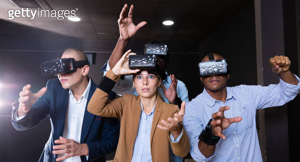 People using virtual reality glasses delighted with videogames 이미지 ...