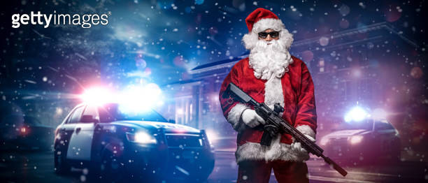 Action Santa: Armed Santa Points Amid Police Lights in Snowy Night ...
