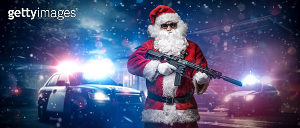 Action Santa: Armed Santa Points Amid Police Lights in Snowy Night ...