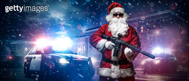 Action Santa: Armed Santa Points Amid Police Lights in Snowy Night ...