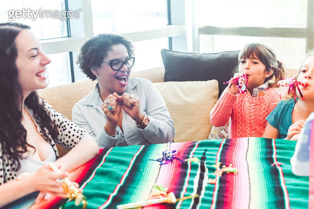 Happy colorful multi-generational family party with kids and adults ...