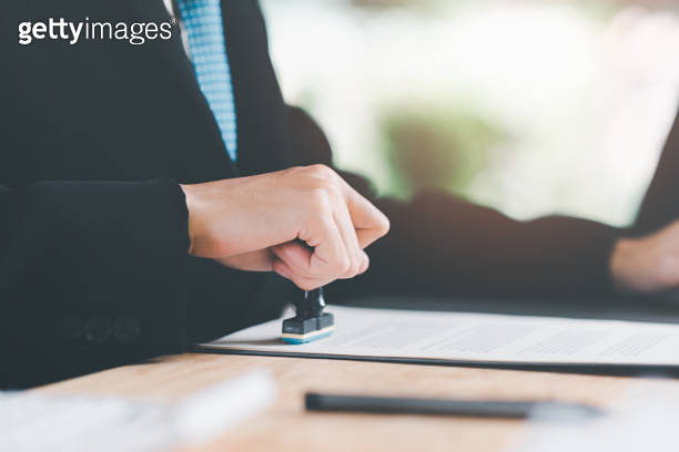 signing a business contract, Approval and confirmation of contract ...