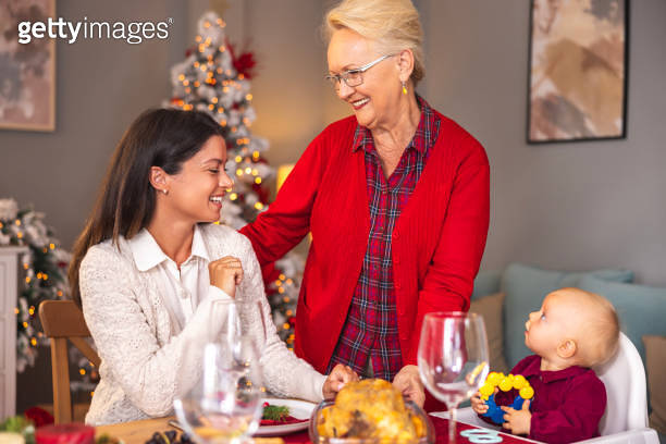 Three generations of women celebrating Christmas at home (1678208376 ...
