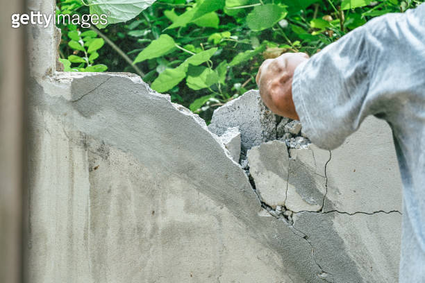 Hand of worker using hammer smashing and demolish on brick wall at ...