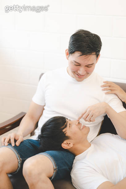 Happy Asian Gay Couple Hug Together On Sofa Asian Lgbt Couple