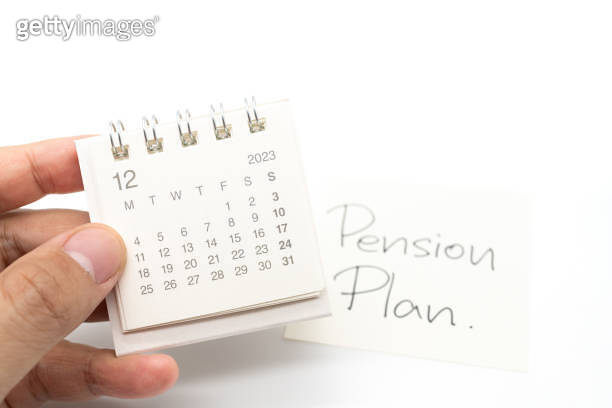 Desk calendar and Pension Plan Note Paper isolated on white background ...