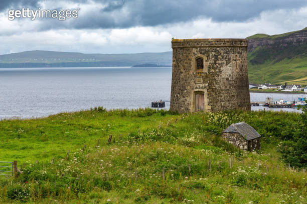Uig bay, with the Uig Tower, a 19th century folly. and the village ...