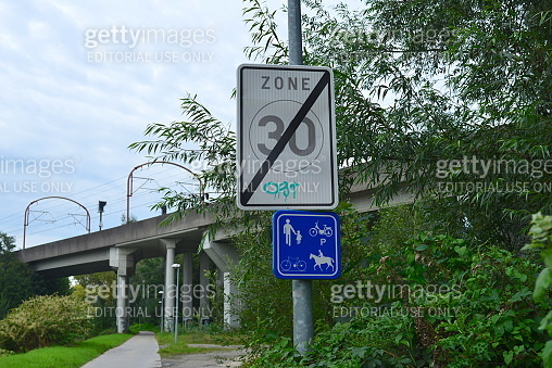 Traffic signs on a calm street in Leuven near stream The Dijle 이미지 ...
