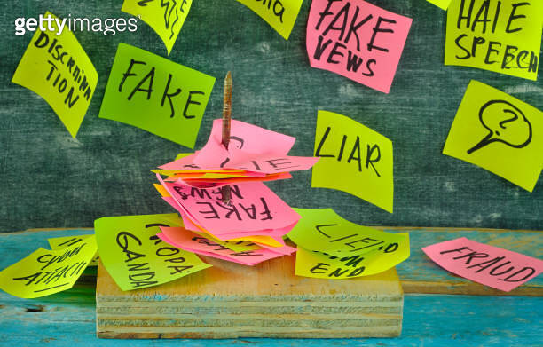 Fight against fake news concept,sticky notes with fake news topics ...