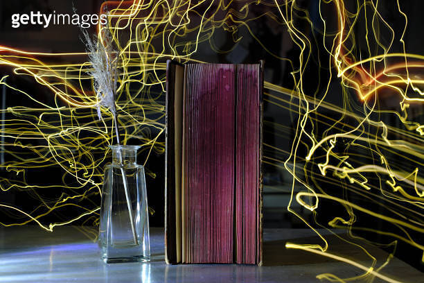 Open book close up with light trails, reading, education, knowledge ...
