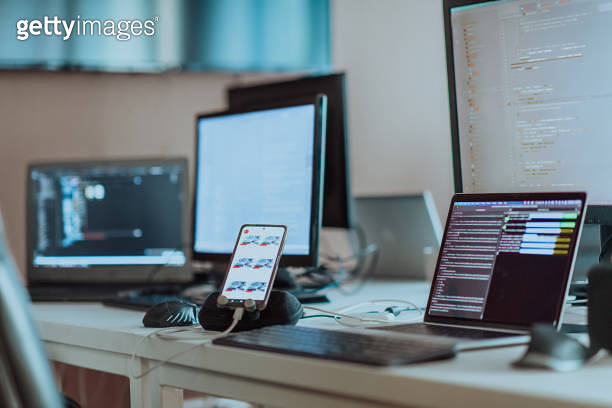 Computer Screens Running Programming Code In Empty Software Developing Agency Office And