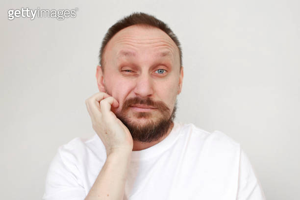 shot mans hand is unrestrained scratching unshaven chin. Overgrown ...