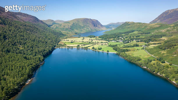 Aerial view of a beautiful lake and rural valley at Buttermere in the ...