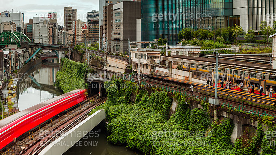 Long exposure (blurred motion) image of subway and rail trains passing ...