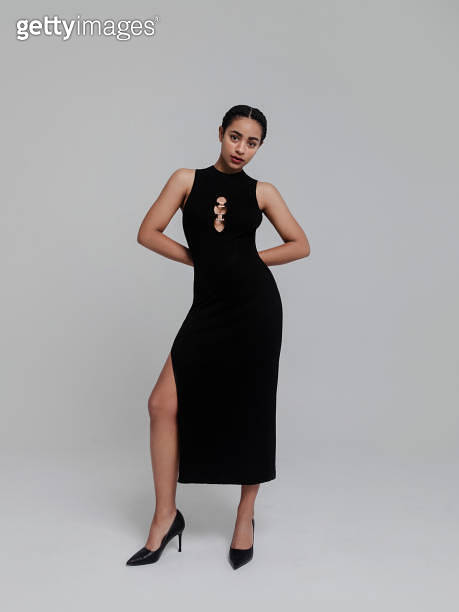 Gorgeous young slim woman wearing luxury designer dress of Black color ...