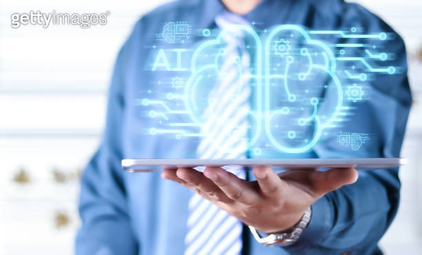 Businessman touching the brain working of Artificial Intelligence (AI) in the futuristic ...