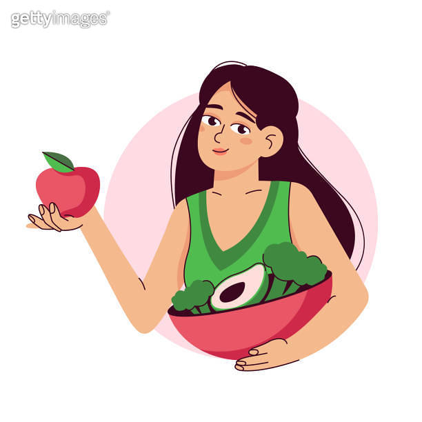 Eating healthy food. The girl is standing with an apple in her hands ...
