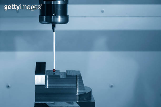The CMM probe measuring the injection mold parts on machining center ...
