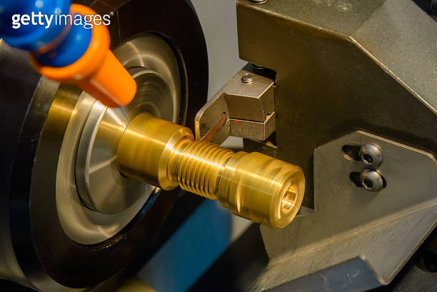 Close up scene the CNC lathe machine slot cutting at the end of brass ...