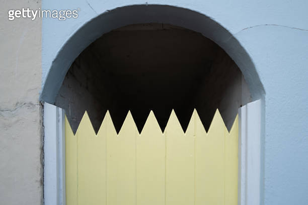 Improvised house gate with sawn sharp edges to help prevent intruders ...