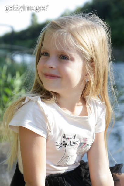 Portrait of adorable little preschool girl with long blonde hair ...