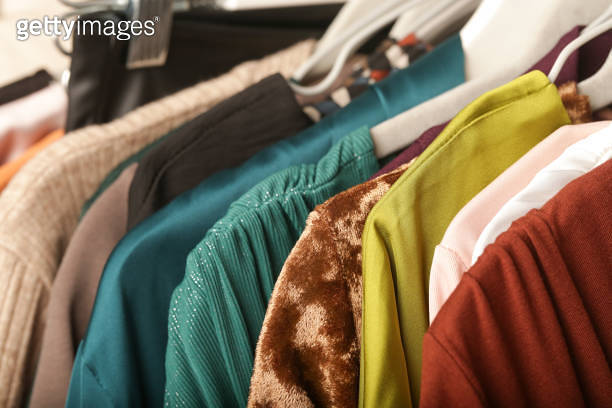 Women's fashion. Different clothes on hangers, close up. Huge selection ...