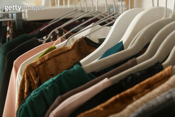 Women's fashion. Different clothes on hangers, close up. Huge selection ...