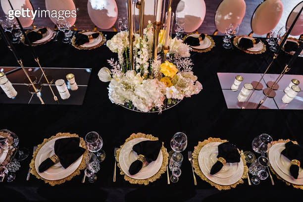 Luxury golden rich decor. Plate decorated napkin, cutlery, glasses ...