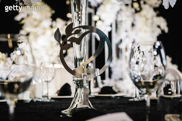 Table number 2. Setting, serving guests closeup. Stands, sign number ...