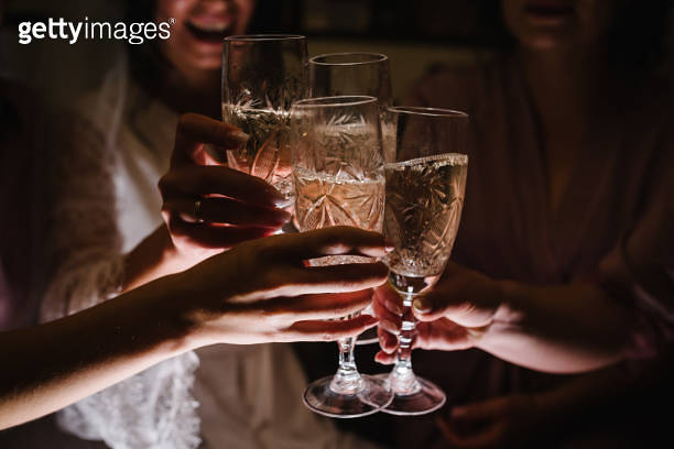 Cheers. People toast. Females cheering with champagne. Girls drink ...