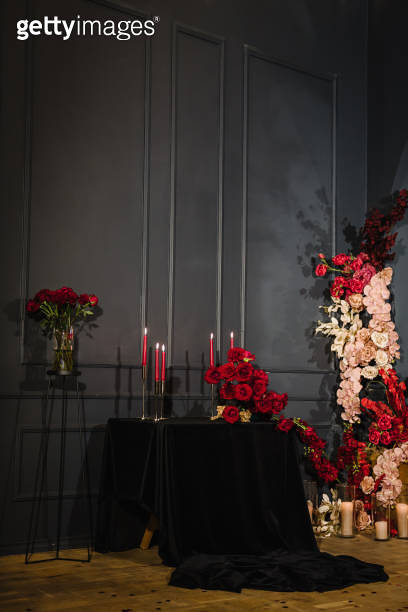 Location decoration red flowers and decor with candles for surprise ...