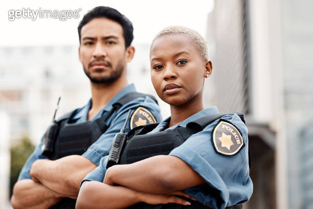 Police, team and arms crossed in confidence for city protection, law ...