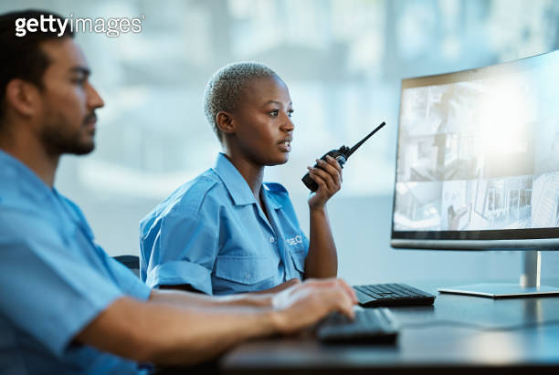 Security guard, safety and control room with a radio and computer ...
