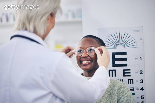 Eye exam, glasses and vision, doctor and patient with women in ...