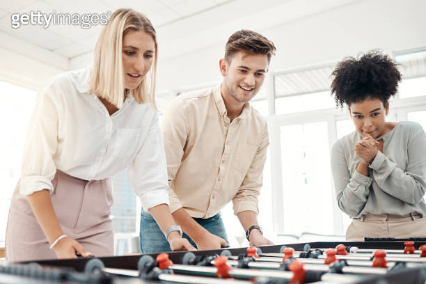 Business people, foosball table and competition in office for team ...