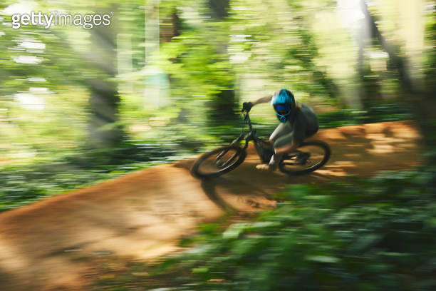 Mountain bike, motion blur and cycling in forest for adventure, speed ...