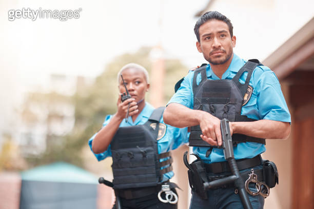 Crime, team and police with an investigation together for security, law ...