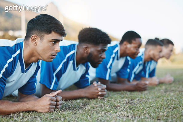Sports group, soccer and team plank on field for fitness training ...