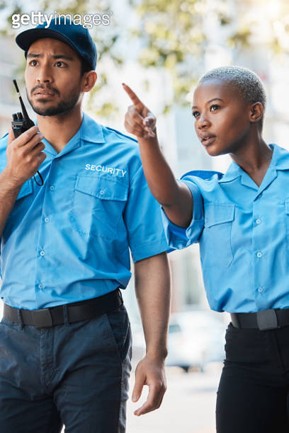 Security guard, safety officer and pointing on street for protection ...