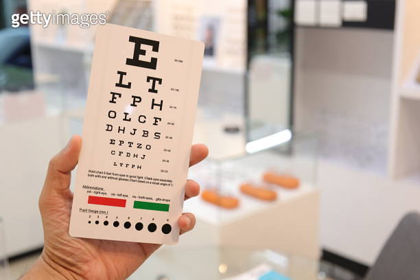 Hand holding charts eye test (1703868835) - 게티이미지뱅크